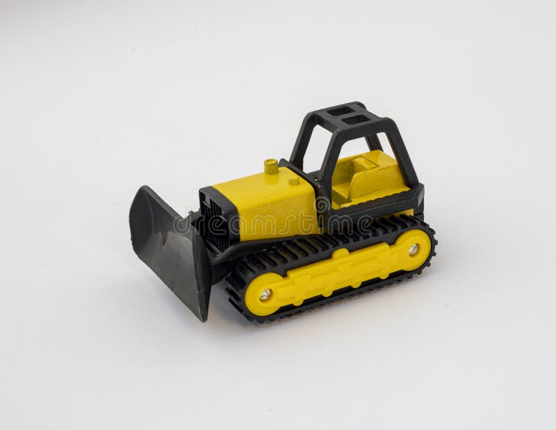 Yellow and Black Toy Bulldozer with Tracks on White Background Stock ...