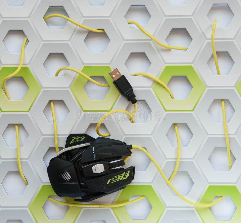 Yellow and Black USB Mouse on White and Green Honeycomb Background ...