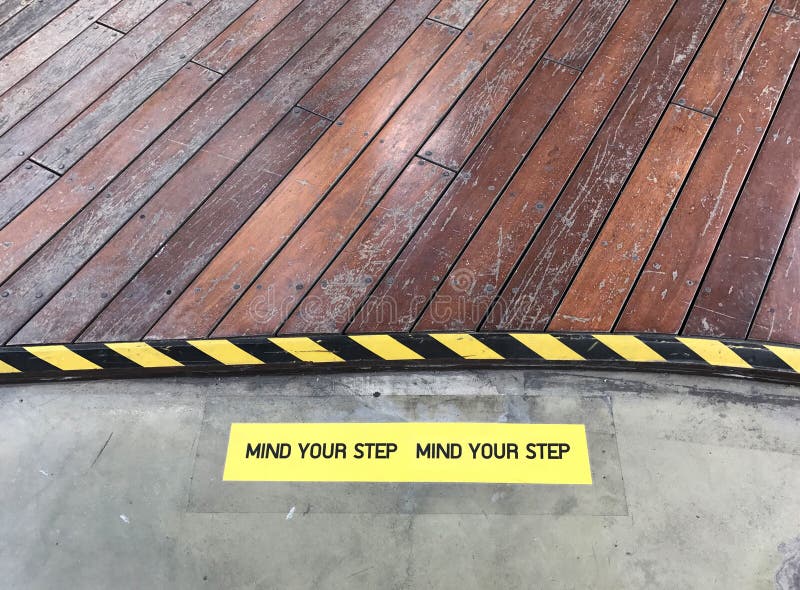 Yellow and Black Warning Sign on Step Stating Stock Photo - Image of ...