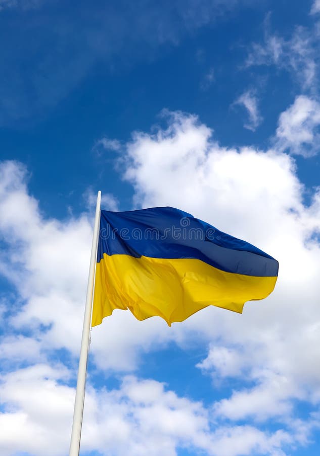 Yellow and Blue Flag of Ukraine and Sky with Clouds in Background Stock ...