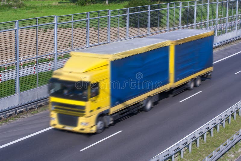 Yellow Blue Truck stock image. Image of lane, delivering - 44021905