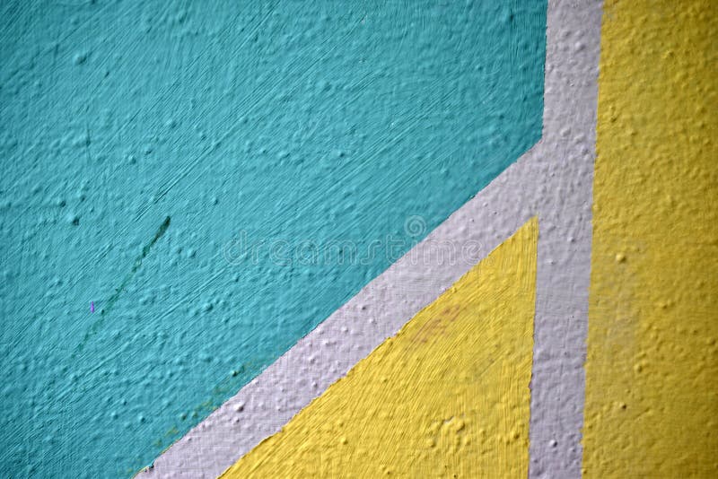 A Yellow and Blue Wall Painted with Stripes and a Triangle Stock Photo ...