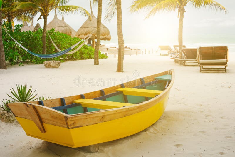 Yellow boat on the beach stock photo. Image of yellow - 172414450