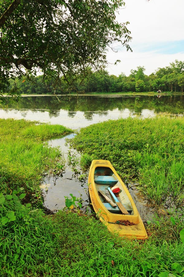 Yellow boat in the river stock image. Image of thailand - 56270323