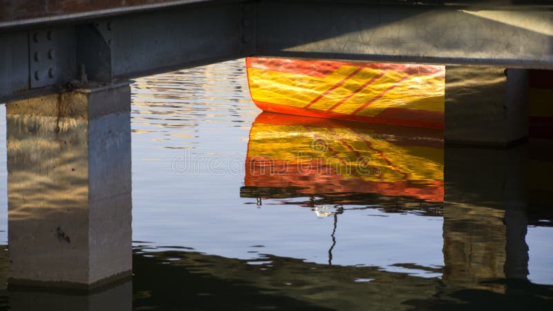 Yellow Boat Surface Reflection Stock Image - Image of surface, color ...