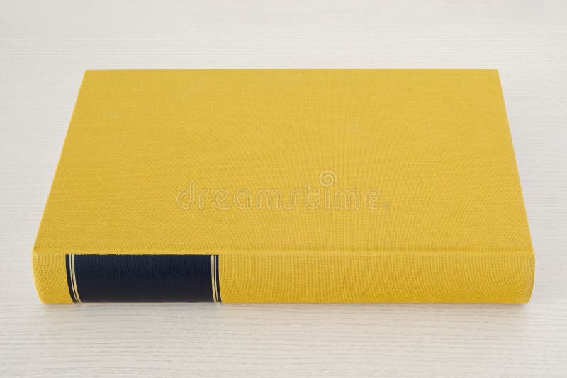 Yellow Book with Black Frame on Spine on the Table Stock Image - Image ...