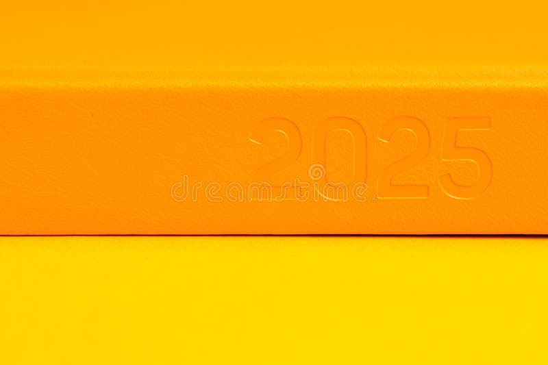A Yellow Book with the Number 2025 on it Stock Image - Image of ...