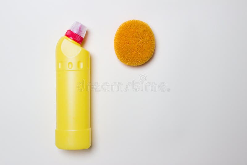 Yellow Bottle with Cleaning Agent on Blue Colored Paper Background ...