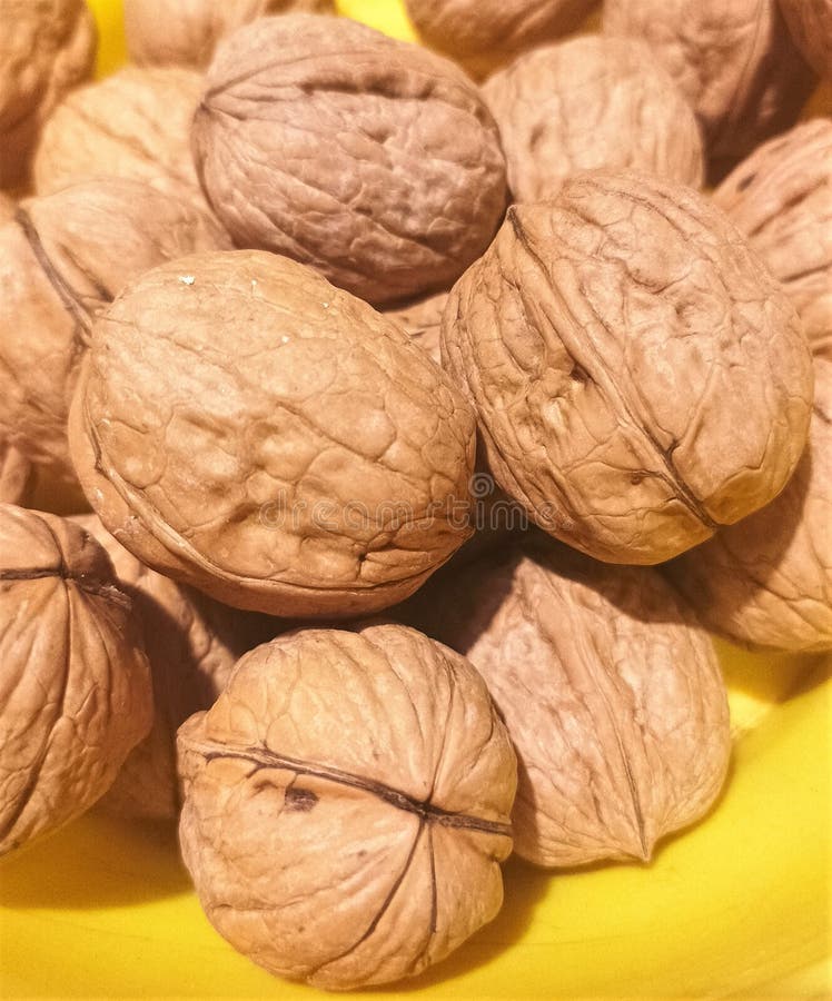A Yellow Bowl Full of Walnuts Stock Image - Image of food, bowl: 264779433