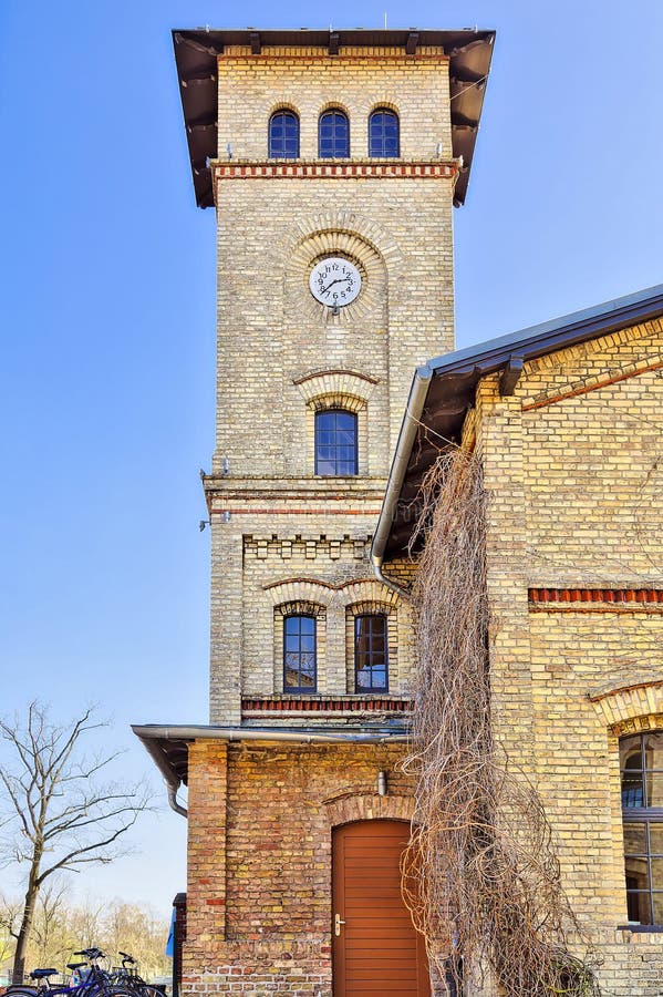 Yellow Brick Building with Clock Tower Stock Photo - Image of ...