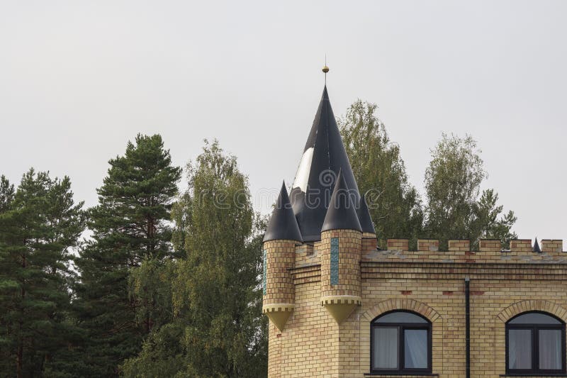 .a Yellow Brick Building with a Pointed Tower Stock Image - Image of ...