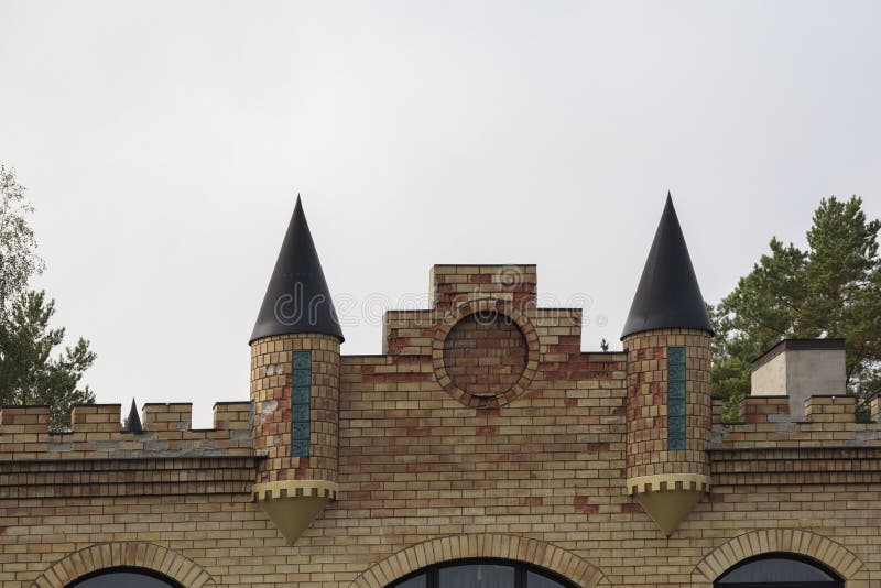 .a Yellow Brick Building with a Pointed Tower Stock Image - Image of ...