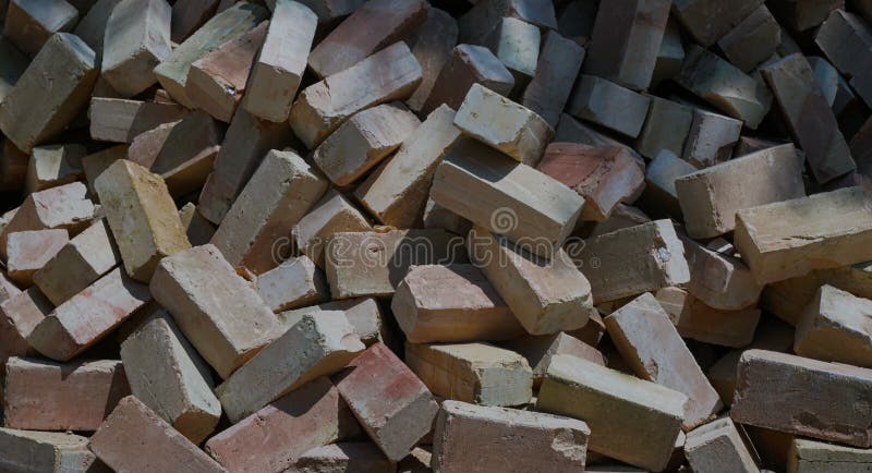 Yellow Brick Piled Up on the Ground Stock Photo - Image of industrial ...