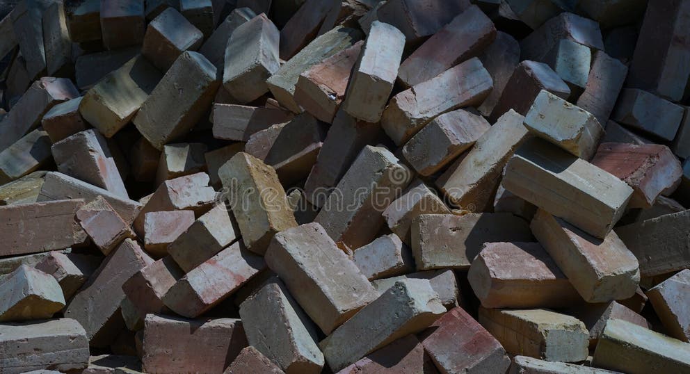 Yellow Brick Piled Up on the Ground Stock Image - Image of color ...
