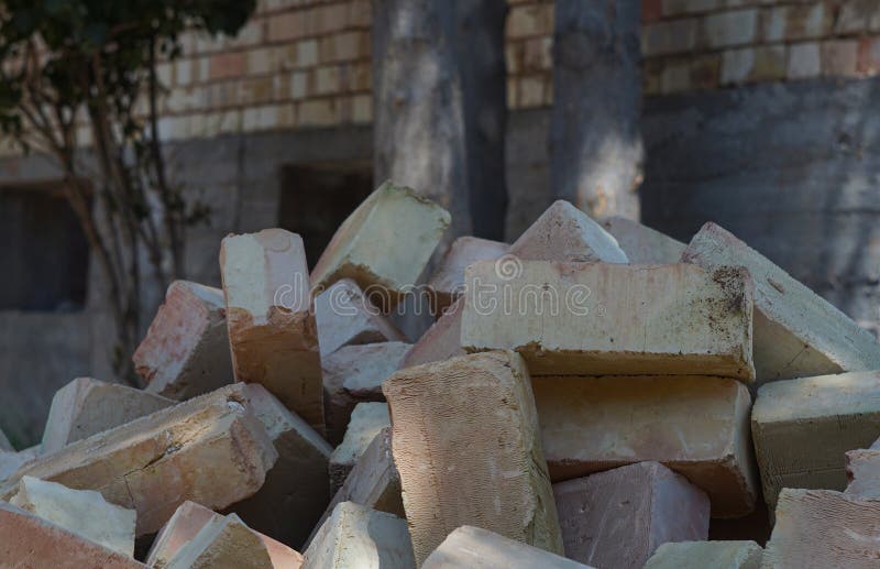 Yellow Brick Piled Up on the Ground Stock Photo - Image of construction ...
