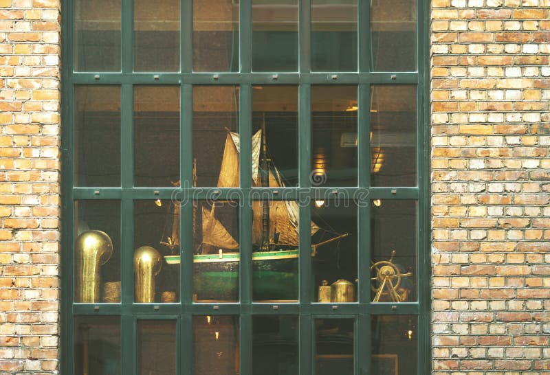 Yellow Brick Wall with a Big Window and Model Sailing Ship Inside Stock ...