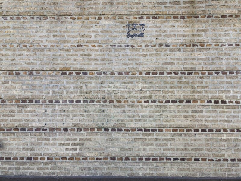 Yellow Brick Wall with Lines of Red Bricks Stock Photo - Image of ...