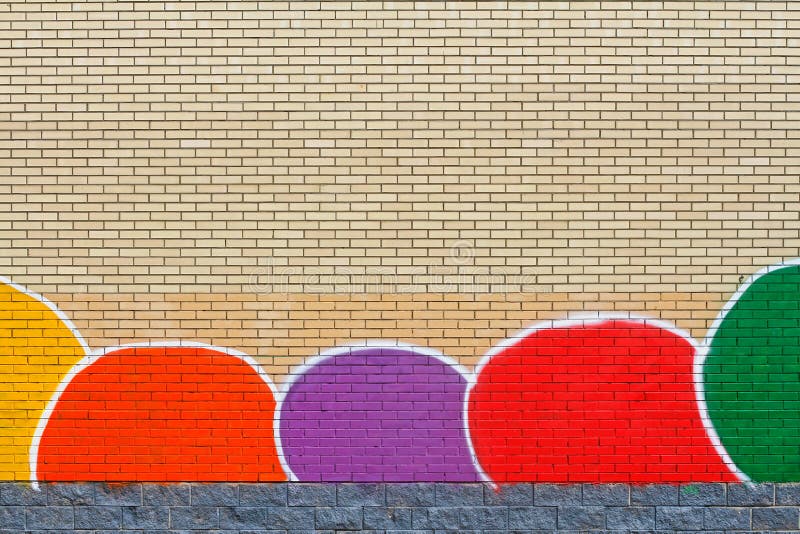 Brick Wall with a Painted Lower Part in the Form of Multi-colored Spots ...