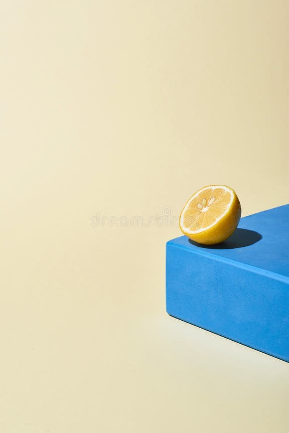 Yellow Bright Lemon Half on Blue Cube on Beige Background. Stock Image ...