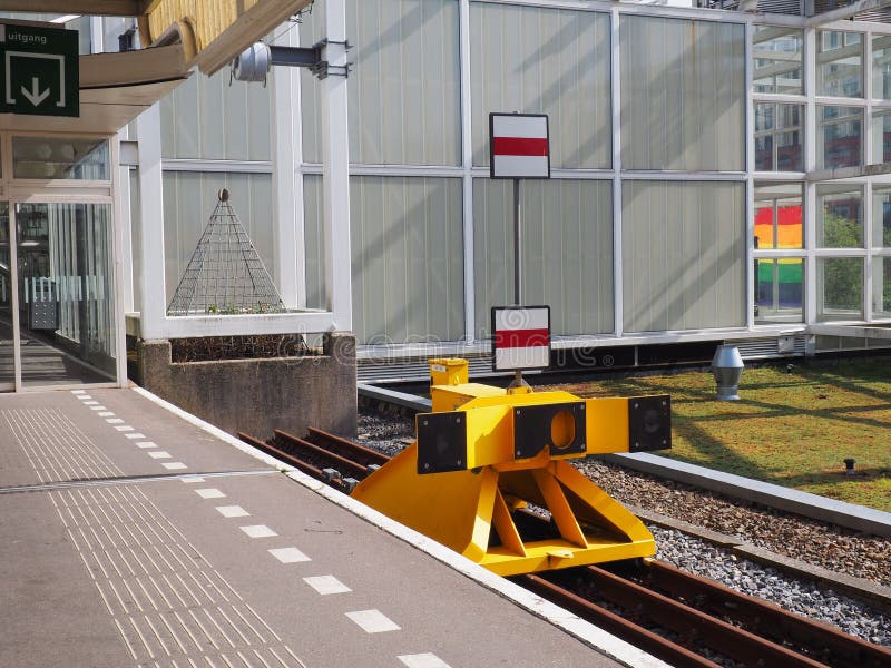 Yellow Buffer Stop at a Railway Station Stock Photo - Image of stop ...