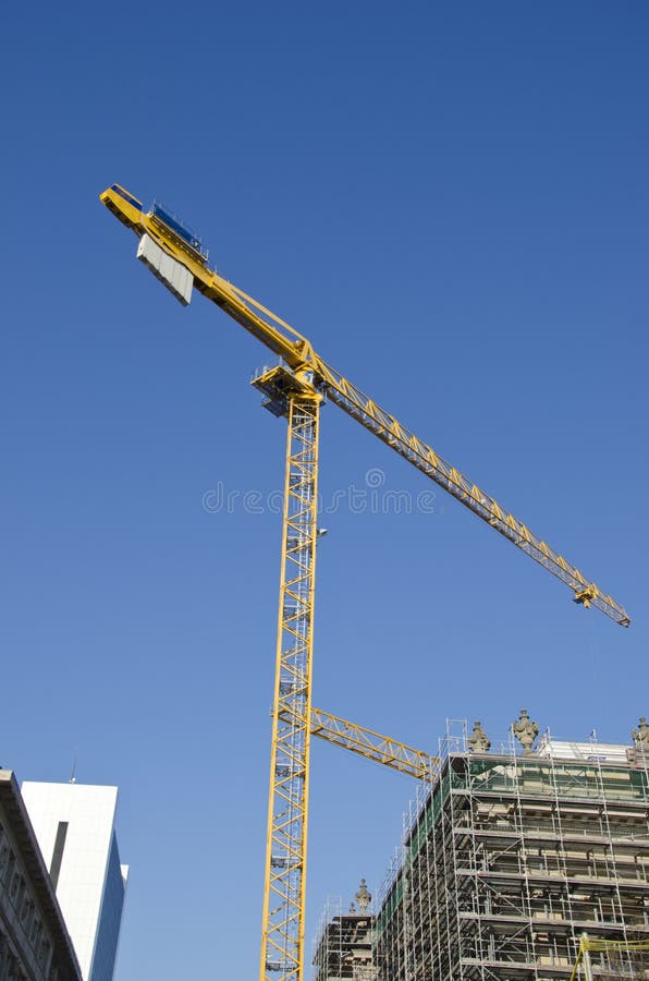 Yellow Building Crane and House Construction in City Stock Photo ...