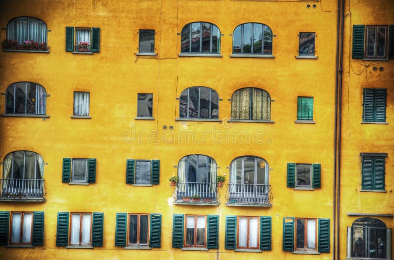 Yellow Building Facade with Green Shutters in Florence Stock Photo ...