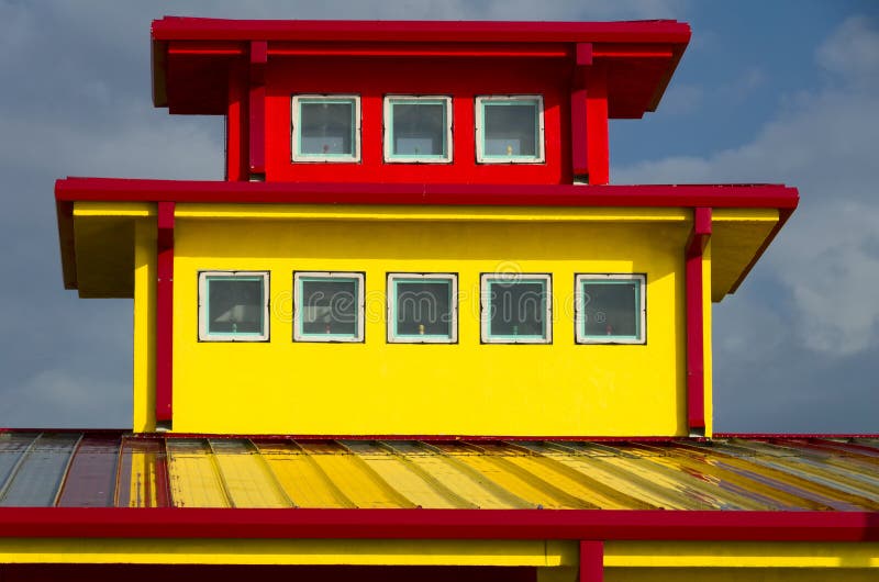 Yellow Building with Red Trim Stock Image - Image of metal, front: 29503441