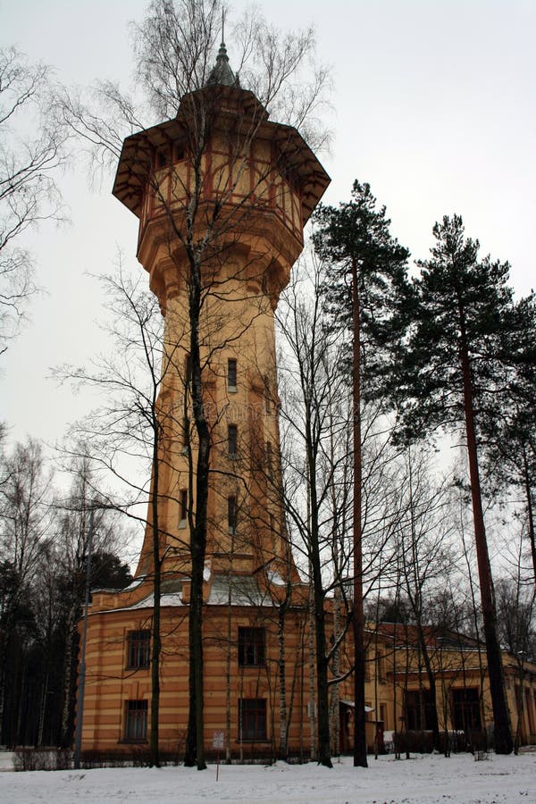 A Yellow Building with a Tall Tower in the Park Stock Photo - Image of ...