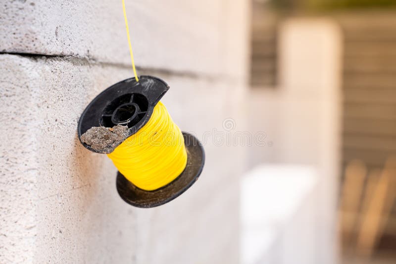 The Yellow Building Thread is Stretched when Laying Aerated Concrete ...