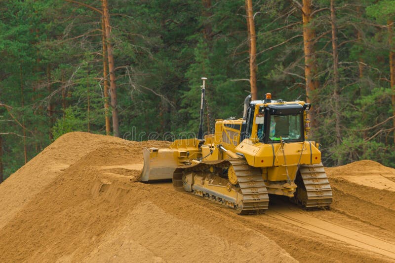 Yellow buldozer at work stock image. Image of large, forest - 36227825