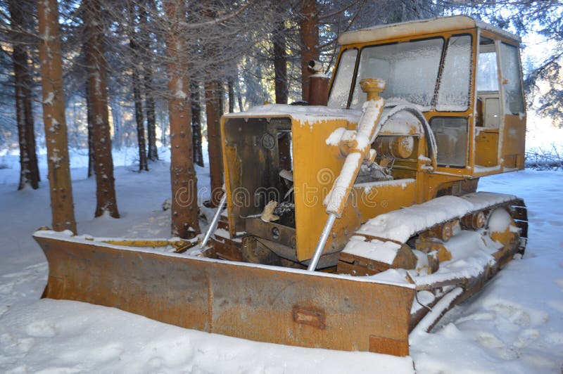 Bulldozer Covered with Snow in Forest Stock Image - Image of bulldozer ...