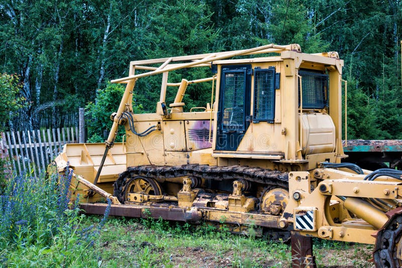 Yellow Bulldozer in the Forest Stock Image - Image of crawler ...