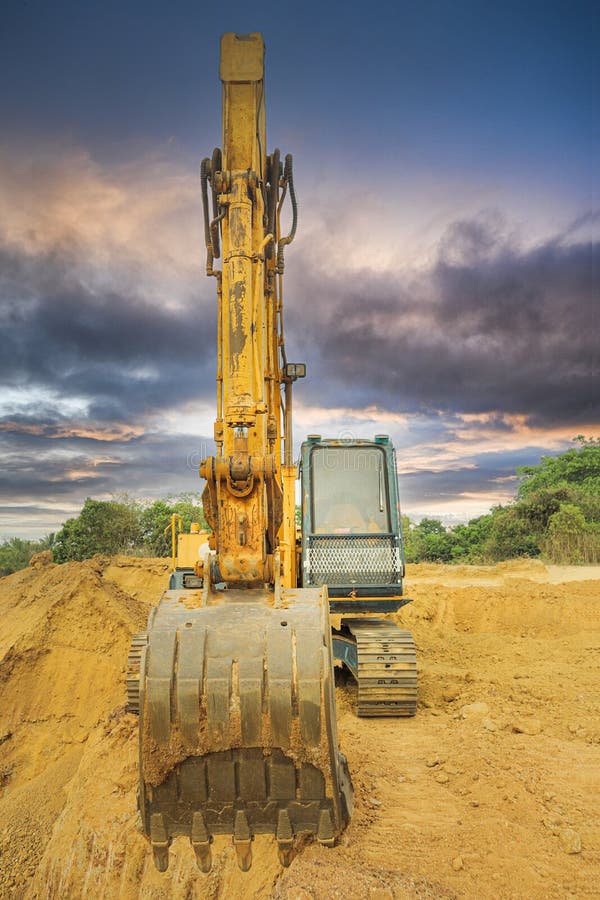 Excavator at Work on a Construction Site, Front View Stock Photo ...