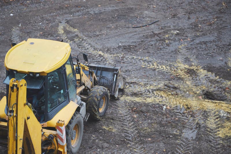 A Yellow Bulldozer Stands on a Cleared Land Plot. Stock Image - Image ...