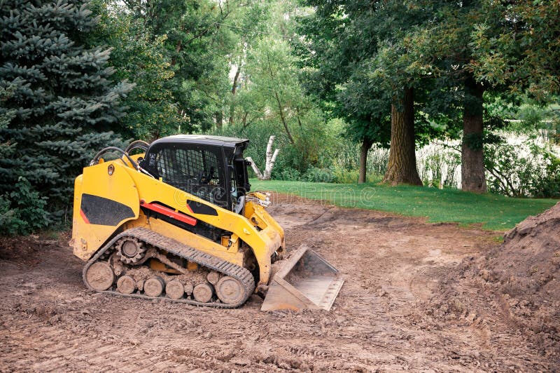 Yellow bulldozer stock photo. Image of dirt, grass, build - 191789806