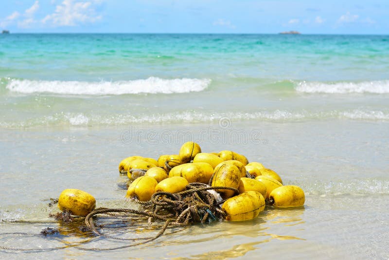Yellow buoy on the beach stock image. Image of natural - 30844995