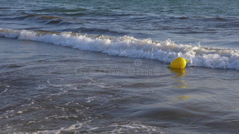 Yellow Buoy Floating in Sea Water Slow Motion. Sea Buoy Floating on ...
