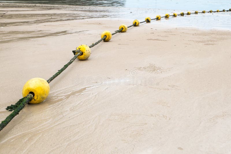 Yellow buoy and rope stock photo. Image of fisherman - 62932432