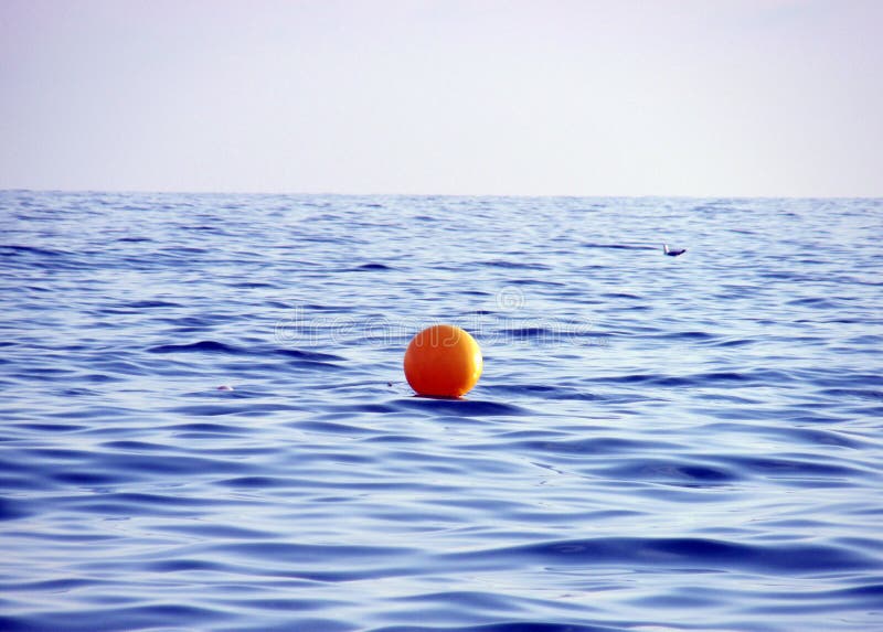 Yellow buoy on sea water stock image. Image of seasonal - 59620923