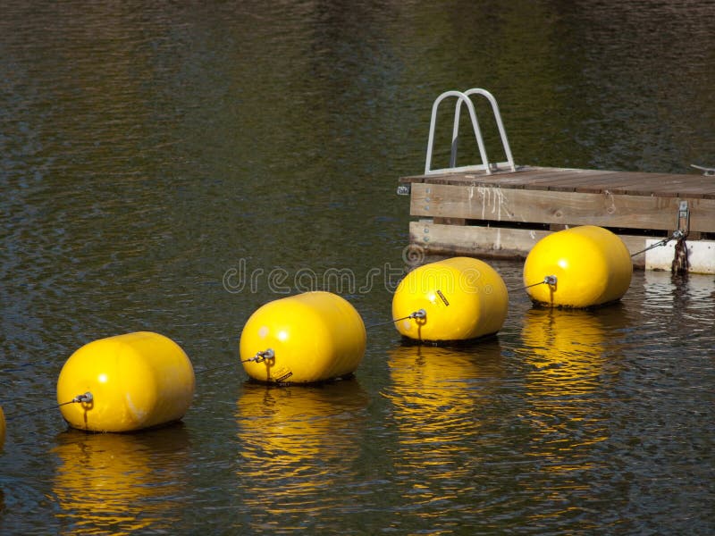 Yellow Buoys and Wooden Dock Stock Image - Image of marine, wooden ...