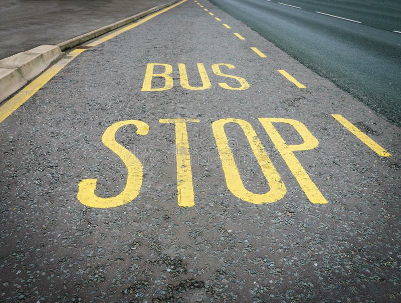 Yellow Bus Stop Sign Painted on the Road Asphalt Stock Image - Image of ...