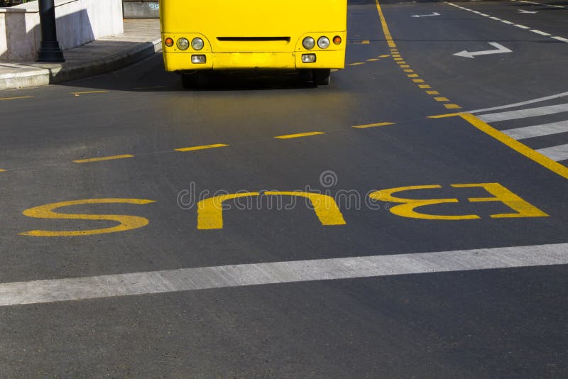 Yellow Bus and Bus Text on the Road in Tbilisi Stock Photo - Image of ...