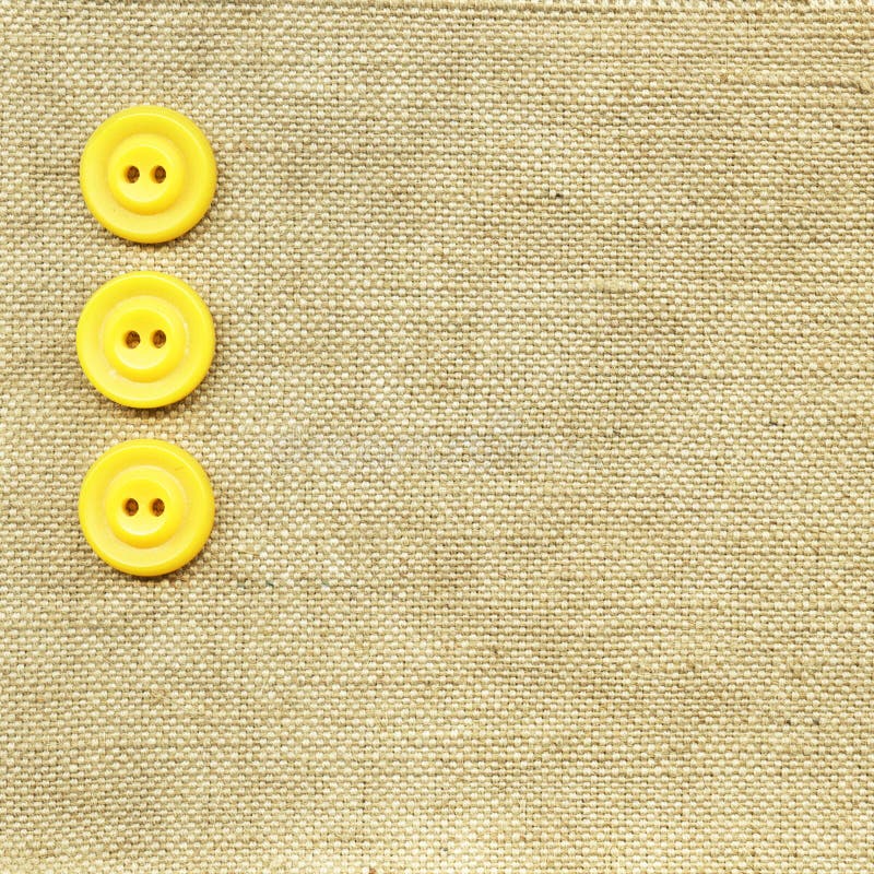 Yellow Buttons on Beige Fabric Stock Image - Image of colorful, closeup ...
