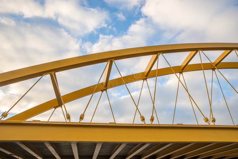 Yellow Cable-stayed Bridge Under a Blue Cloudy Sky Stock Photo - Image ...