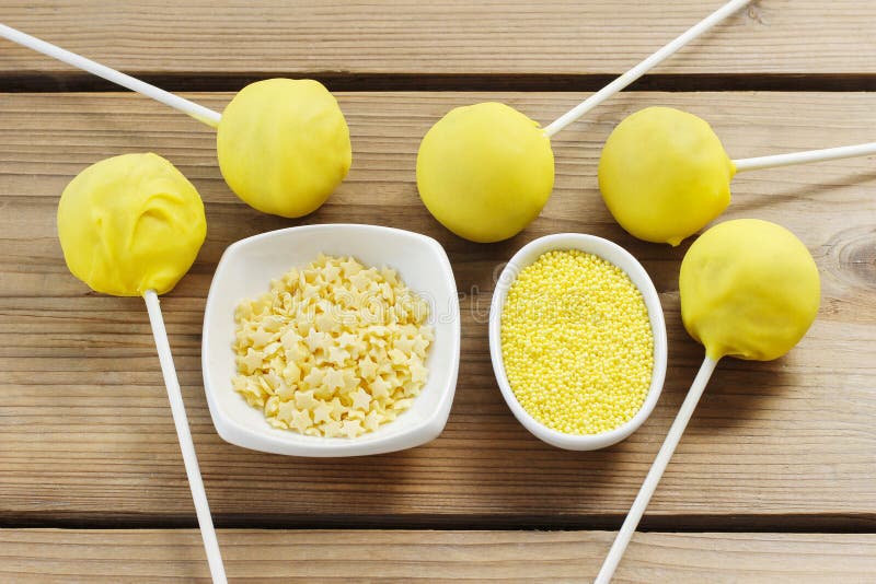 Yellow cake pops stock photo. Image of icing, decoration - 44015662