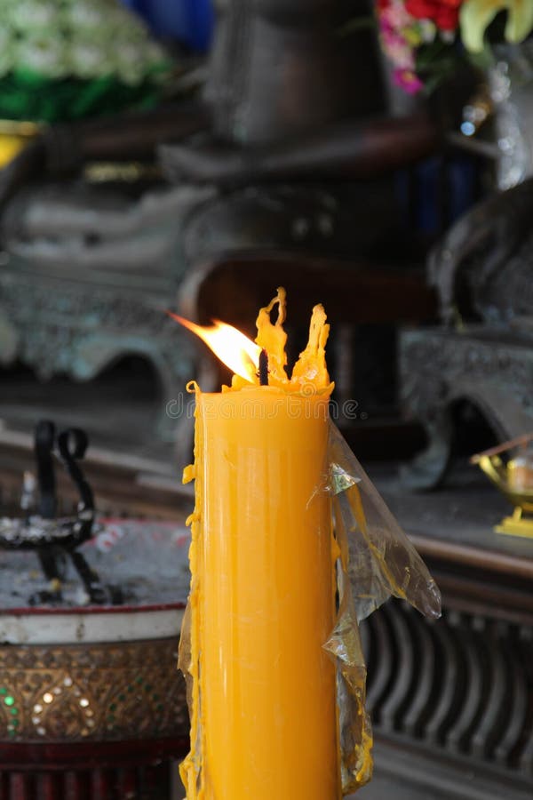Yellow candle is burning stock photo. Image of lamp - 179640854