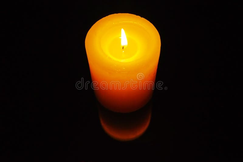 Yellow candle in dark stock photo. Image of decoration - 11740528