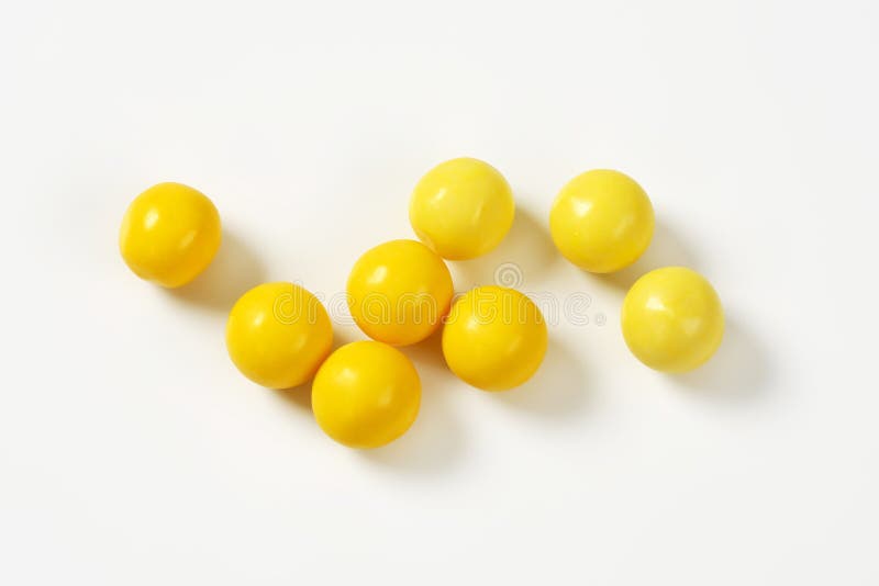 Yellow candy balls stock image. Image of group, gumballs - 71550979
