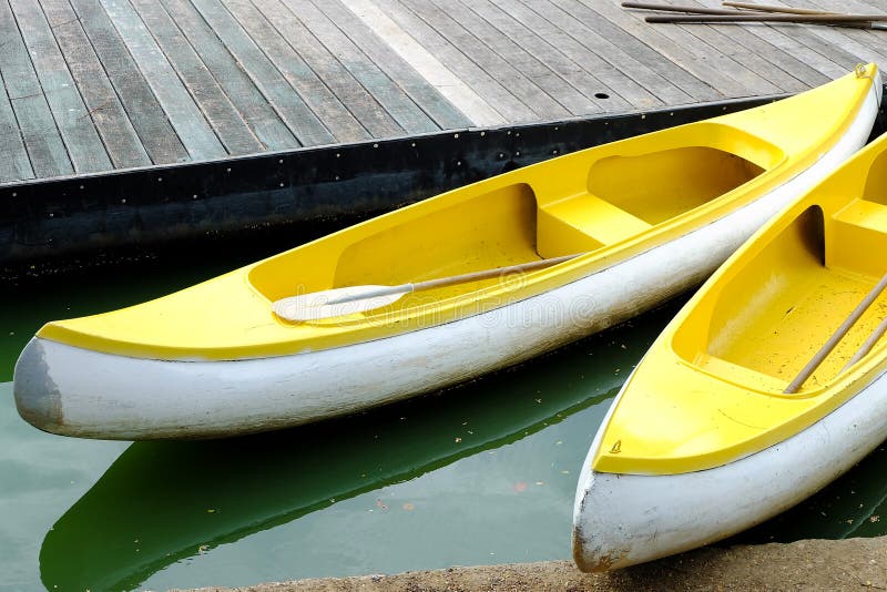 Yellow canoes. stock image. Image of boating, yellow - 73700095