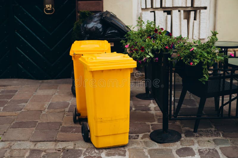 Yellow Recycling Cans Out on the Street for Pick Up. Trash Recycle. Bin ...